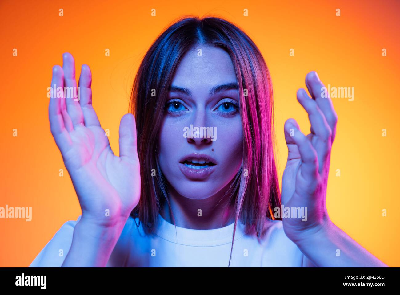 Closeup face of young stressed girl looking at camera isolated on ...