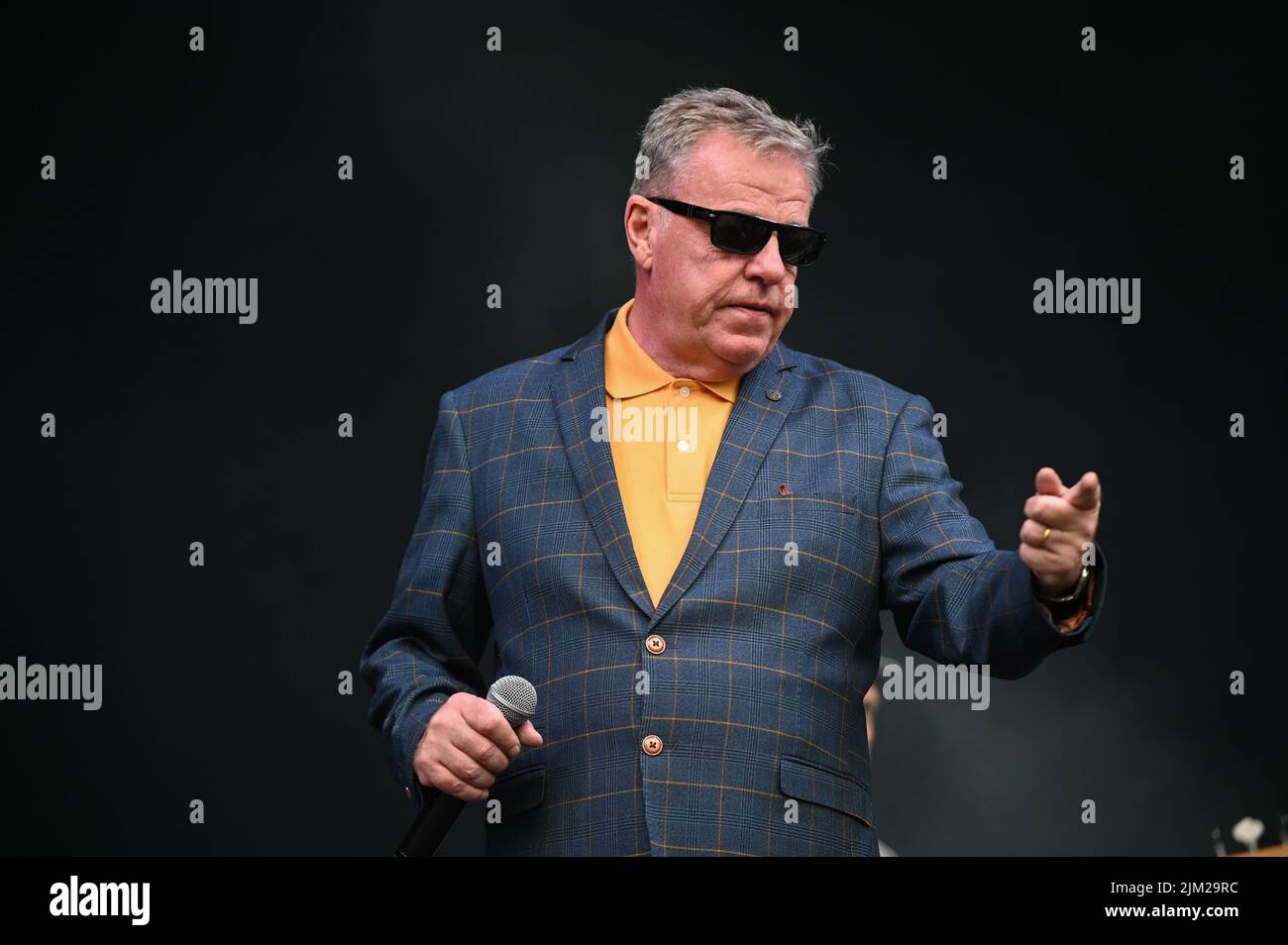 Lead Singer, Graham McPherson, known by his stage name Suggs, performs ...