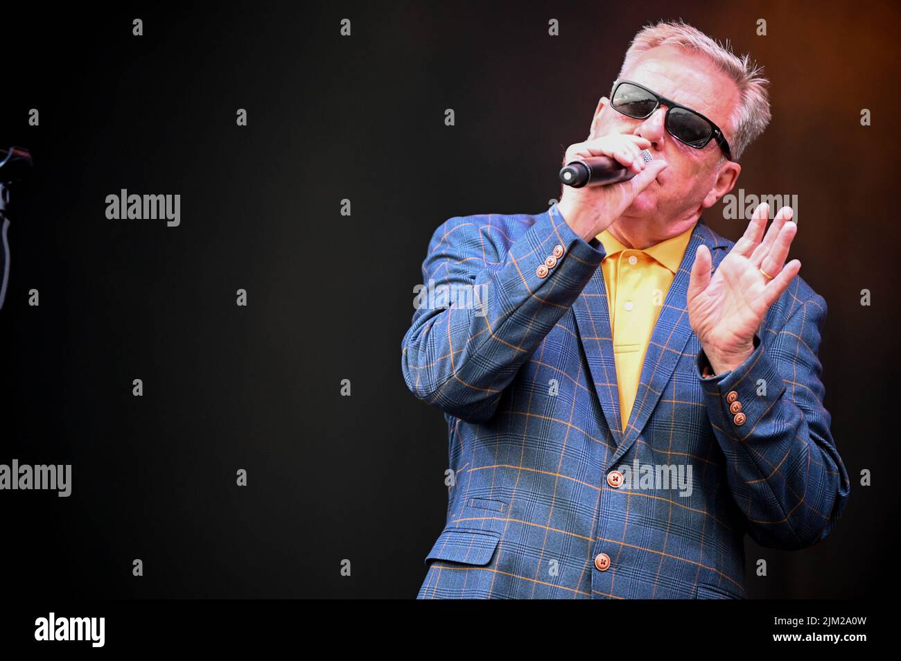 Lead Singer, Graham McPherson, known by his stage name Suggs, performs ...