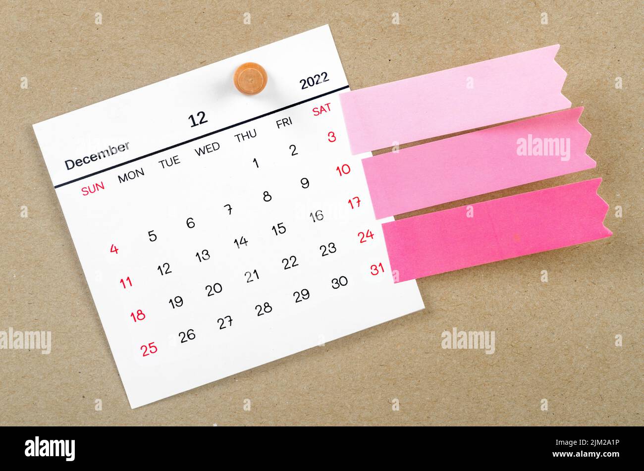 December 2022 calendar with blank adhesive note paper on brown ...