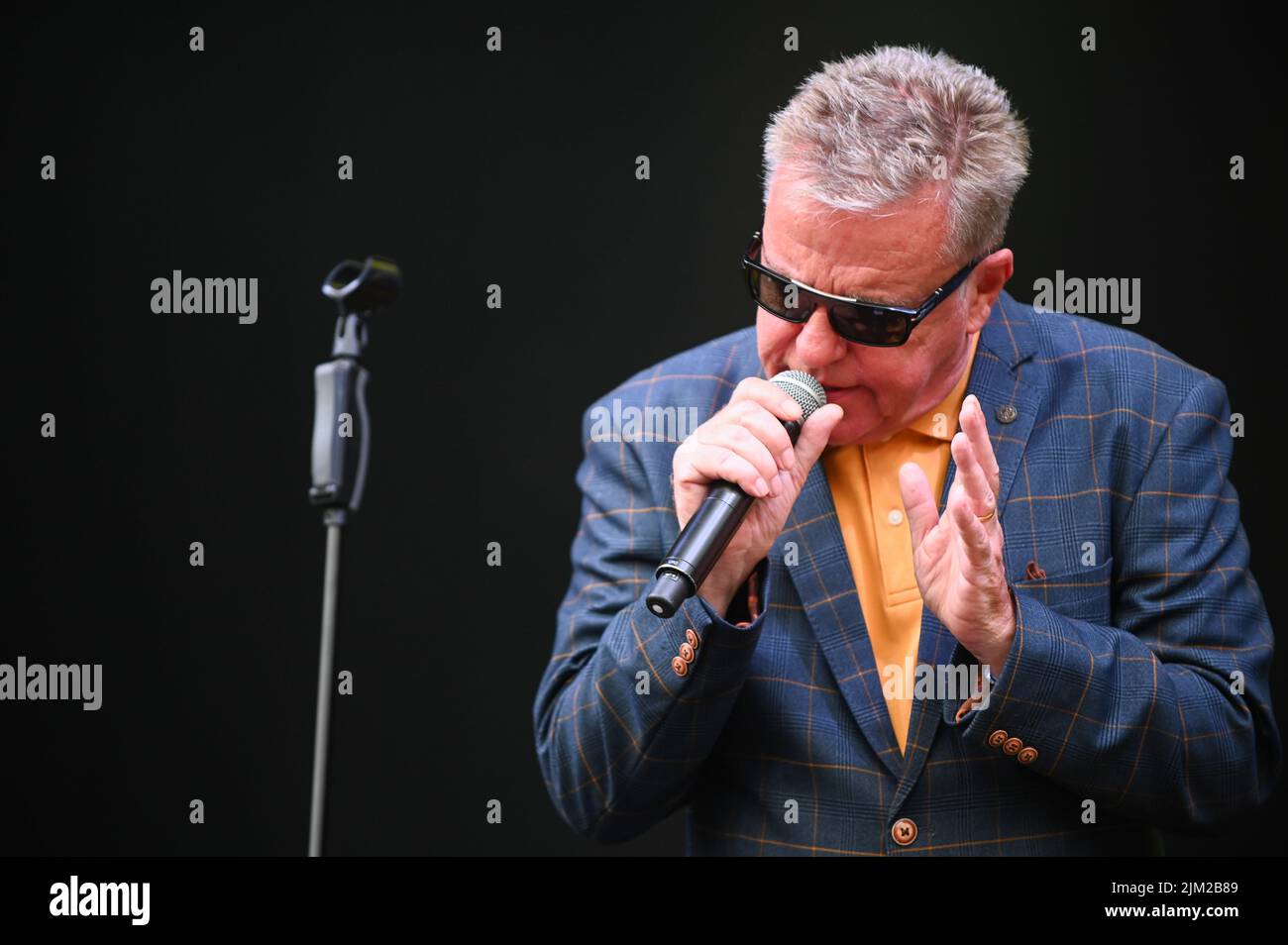 Lead Singer, Graham McPherson, known by his stage name Suggs, performs ...