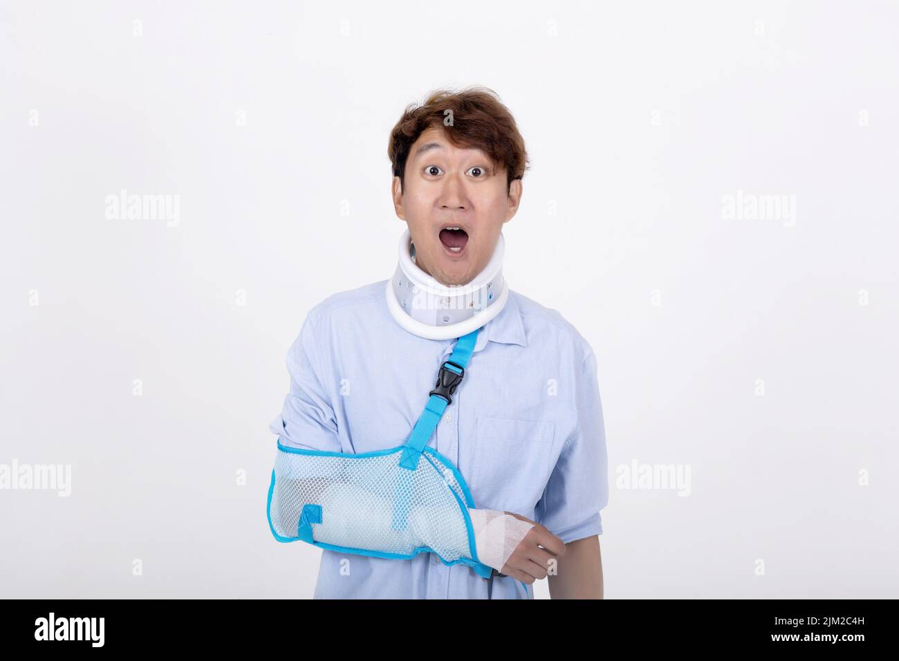 Portrait of Asian man with broken arm and neck feeling surprised and ...