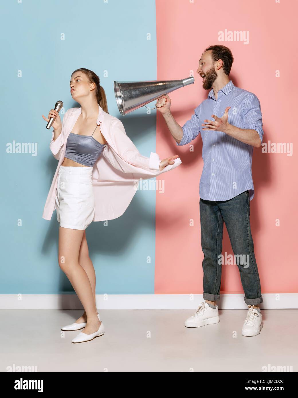 Couple of young funny and happy man and woman having fun isolated over ...