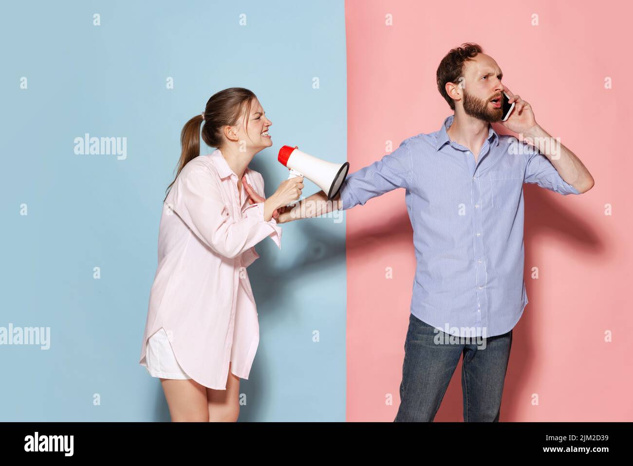 Couple of young funny and happy man and woman having fun isolated over ...