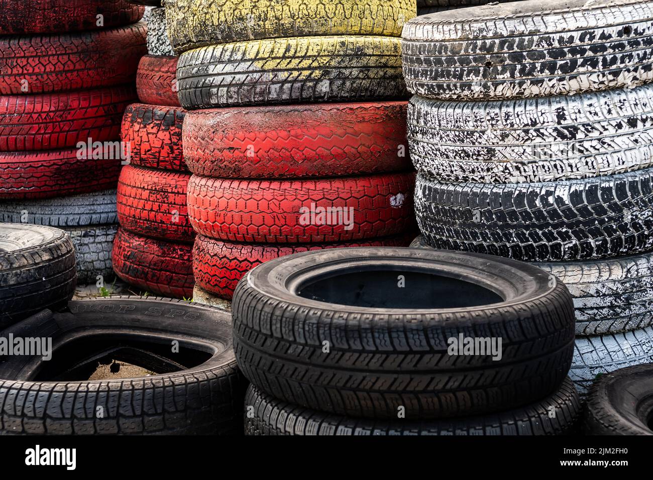 Pile Of Old Used Car And Bike Tyres Representing Hazardous Waste And ...