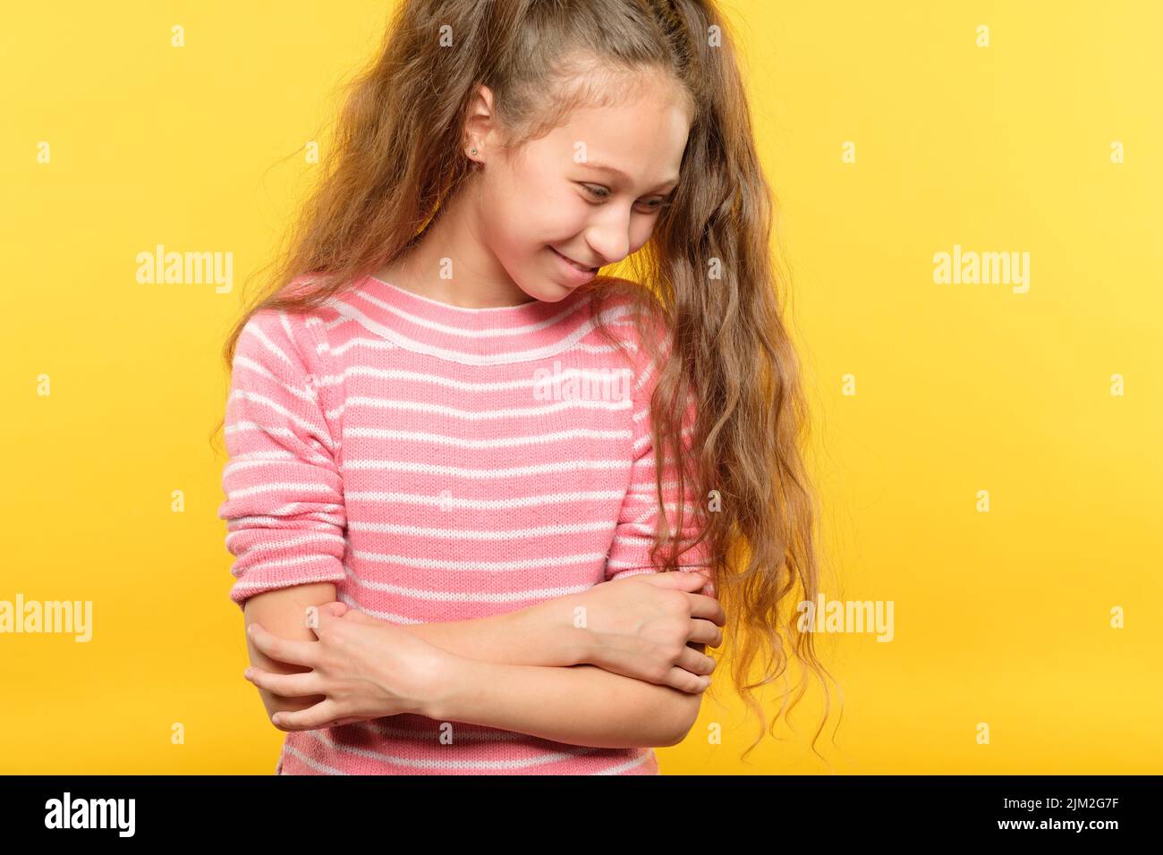 cute shy smiling girl embarrassed child emotion Stock Photo - Alamy