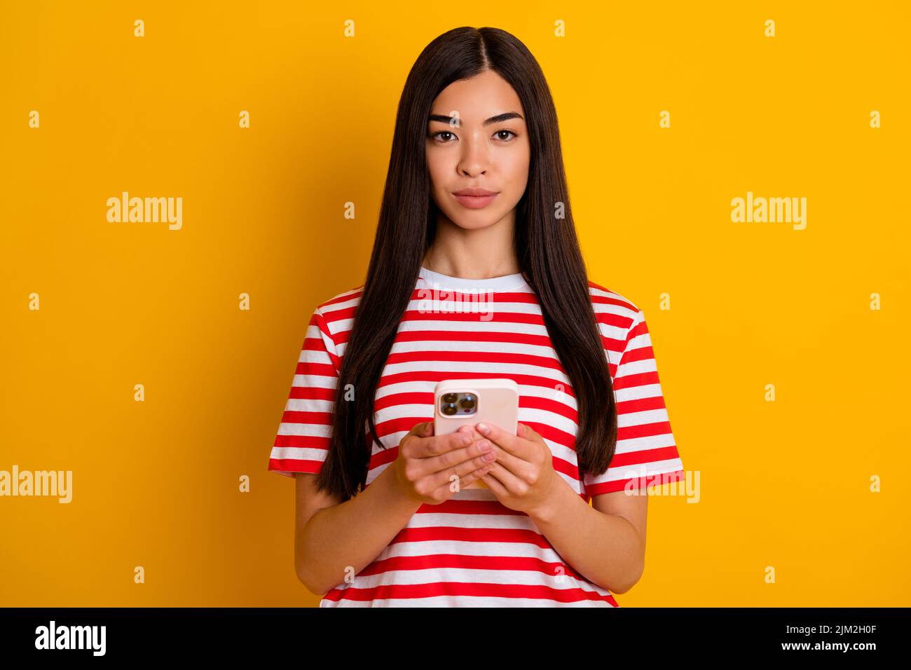 Portrait of nice charming girl hold telephone black hairdo wear red ...