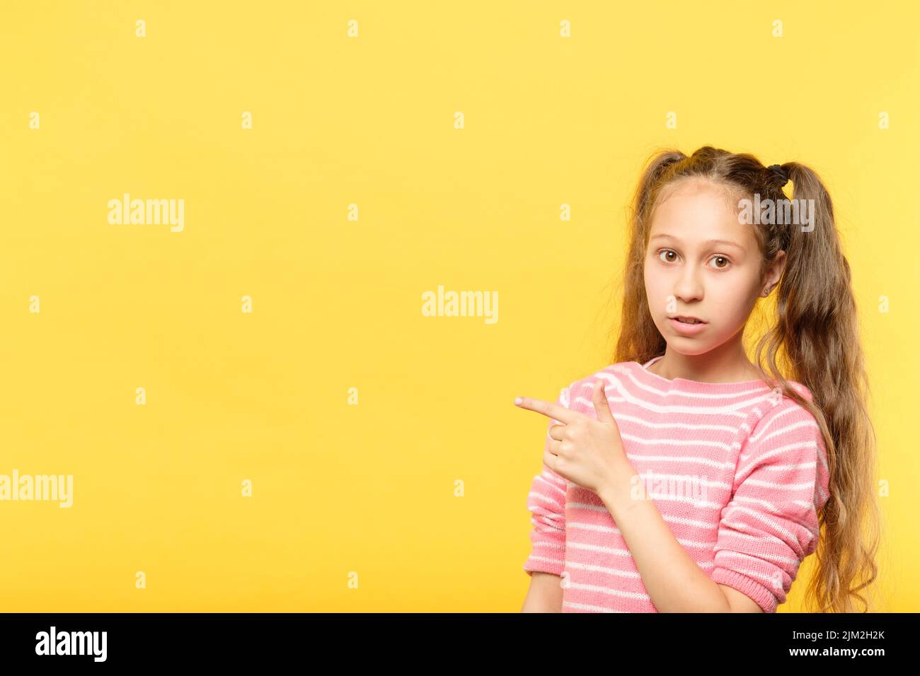 look left serious girl point index finger empty Stock Photo - Alamy