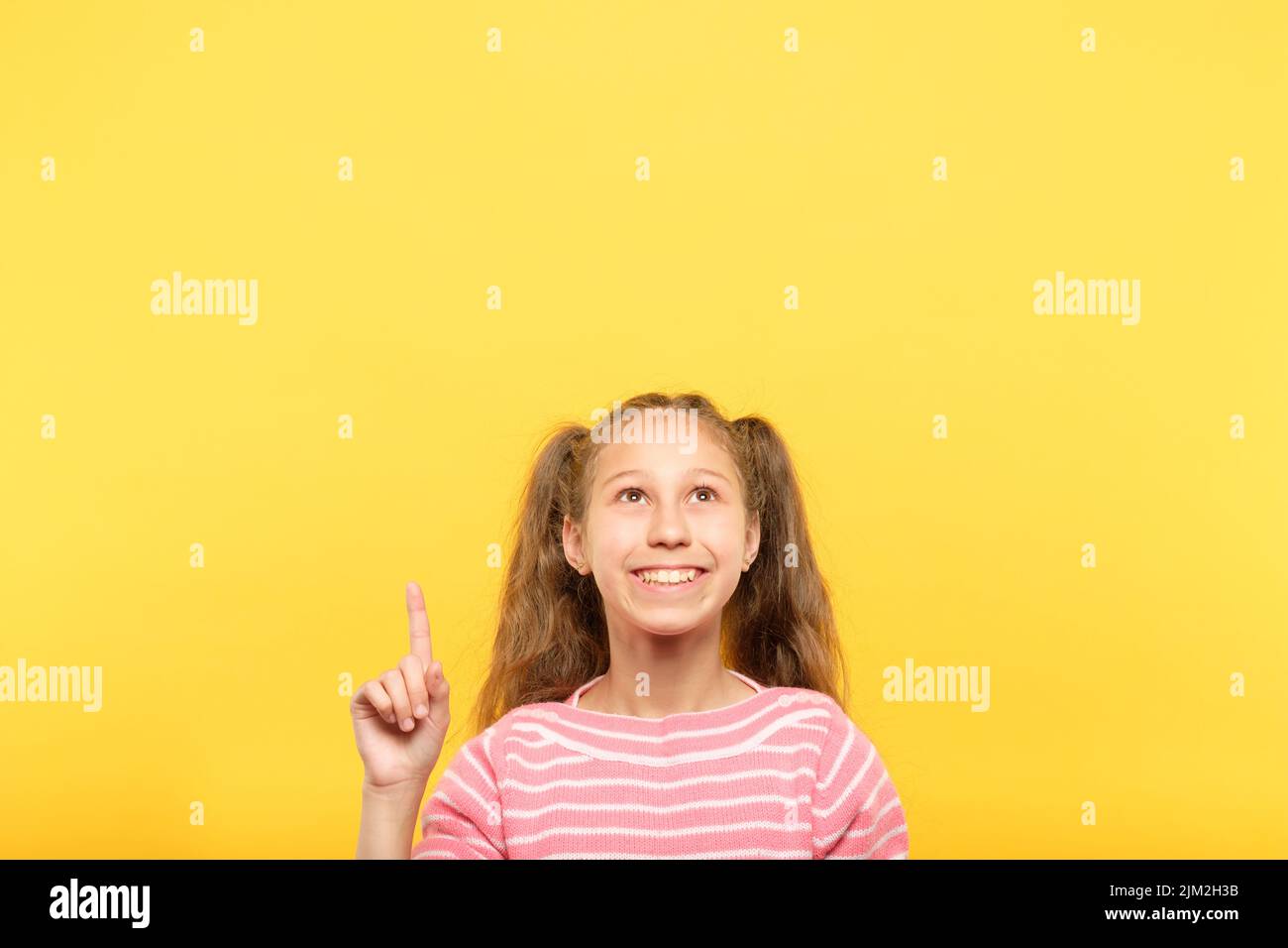 look above girl point index finger virtual object Stock Photo - Alamy