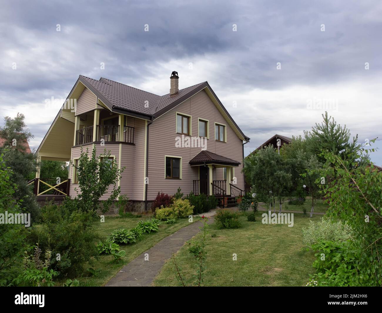 Rural landscape in countryside and Country house with tiled roof and ...