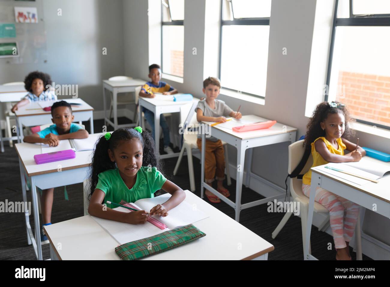 Students sitting desk classroom hi-res stock photography and images - Alamy