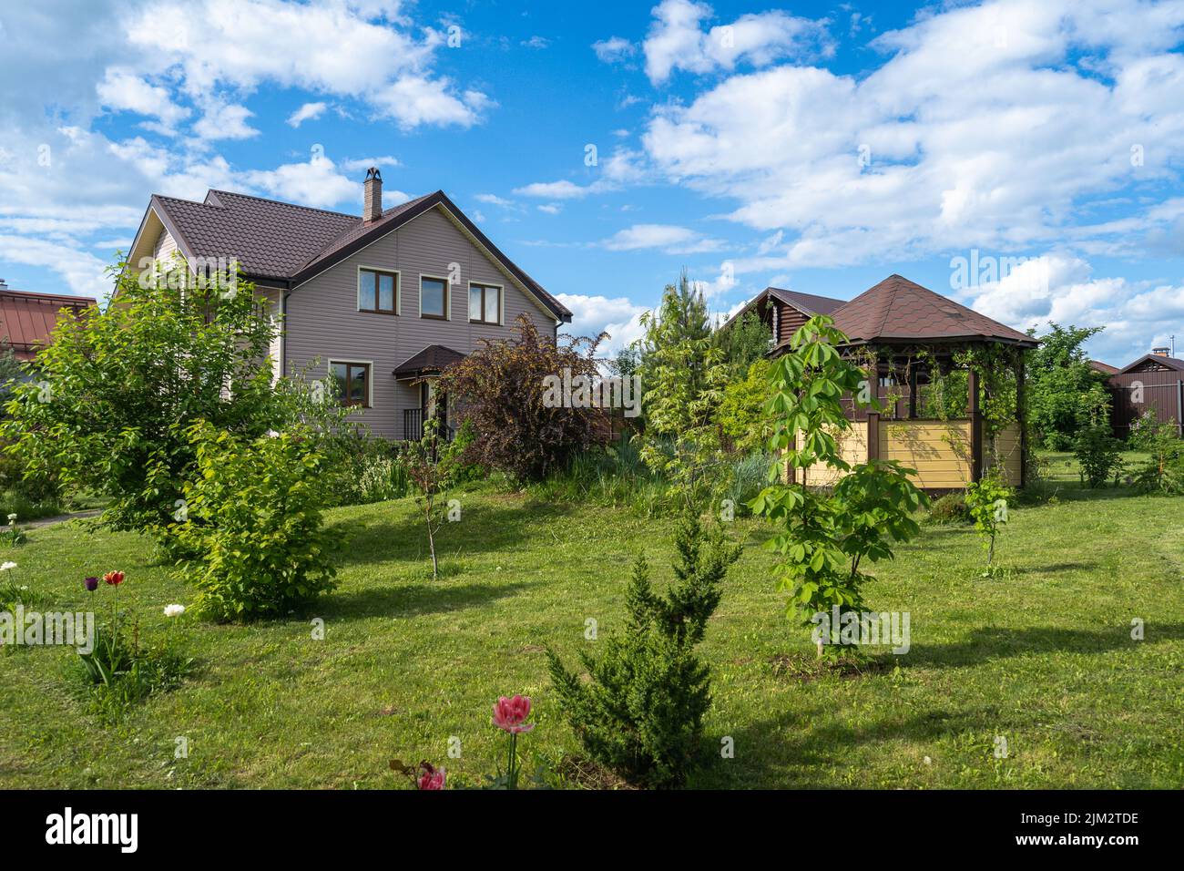 Rural landscape in countryside and Country house with tiled roof and ...