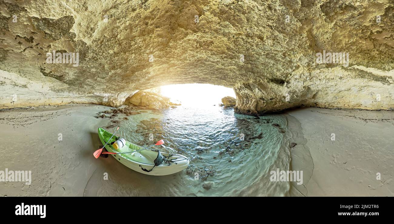 Aerial view kayak in the cliffs inside the cave of Petit Sperone beach ...