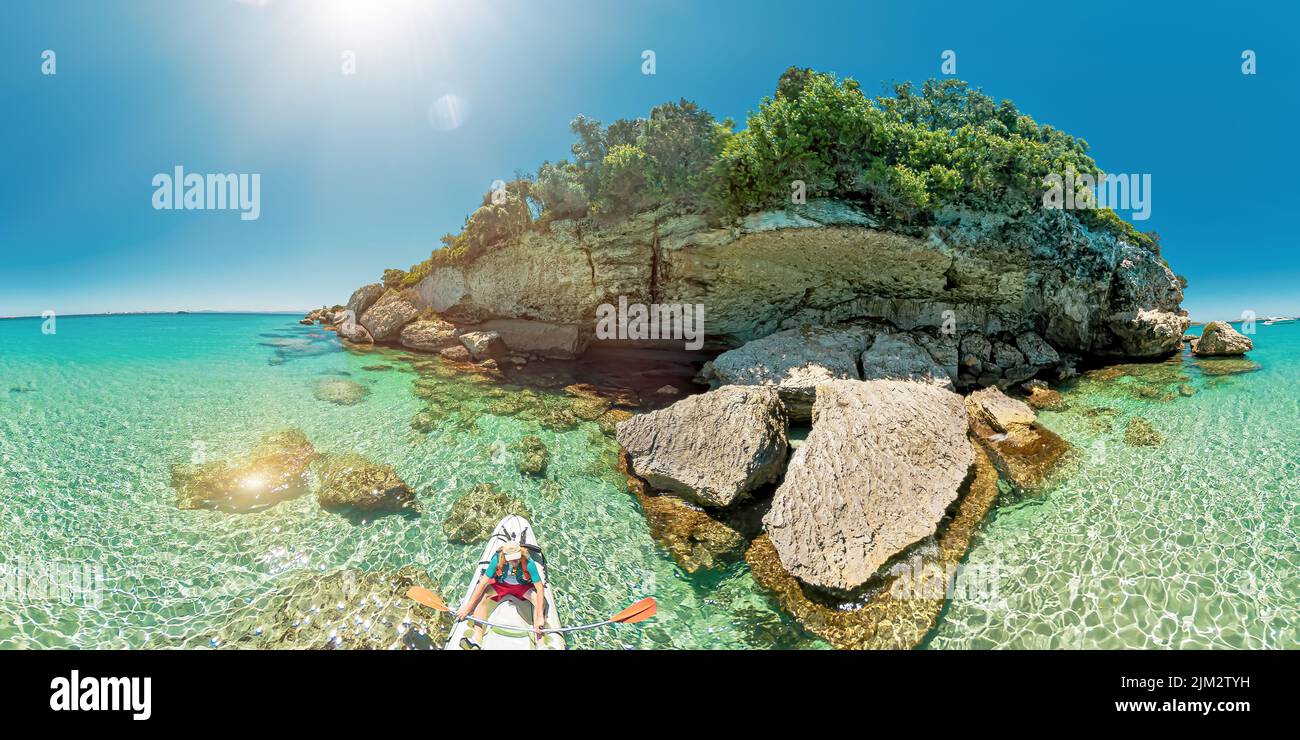 Aerial view kayak in the cliffs and cave of Petit Sperone beach, close ...