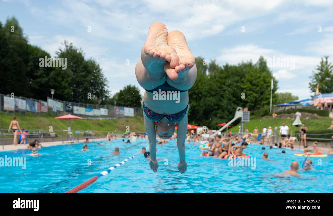 Bielefeld, Germany. 04th Aug, 2022. A swimmer jumps from a starting ...