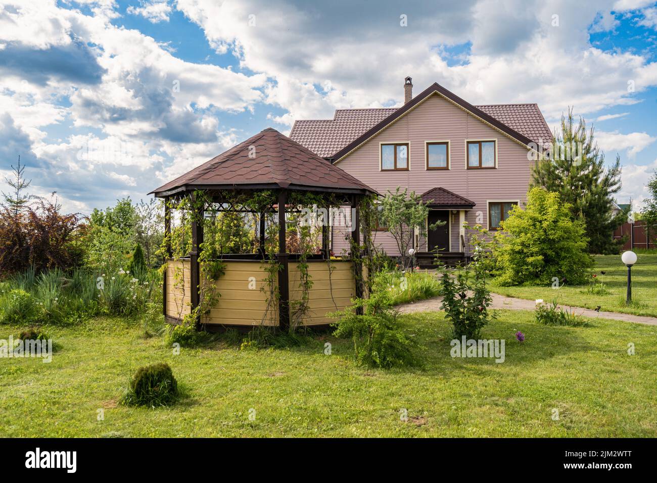 Rural landscape in countryside and Country house with tiled roof and ...