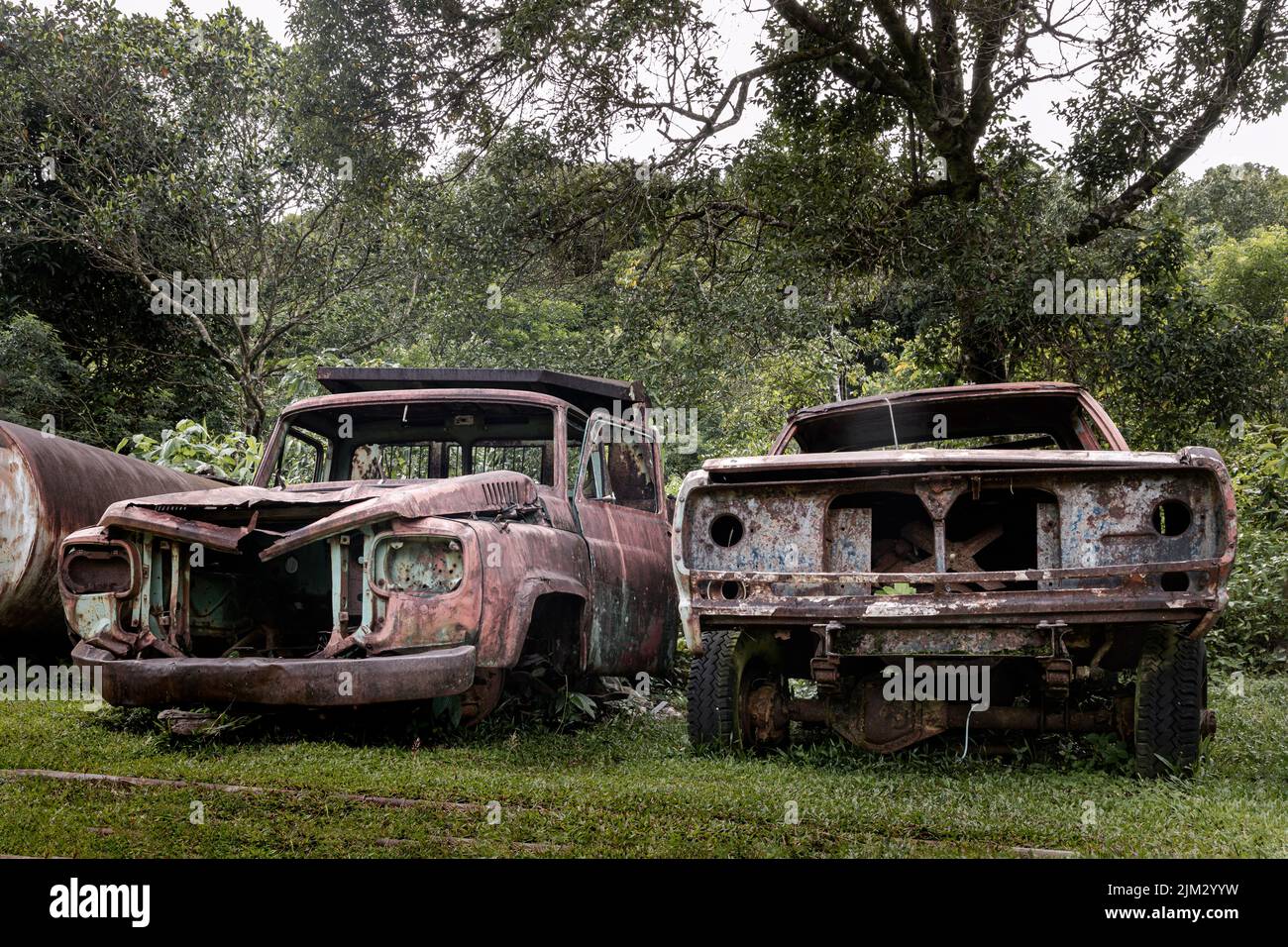 Front view two old vintage truck car wreck used to transport ore from ...