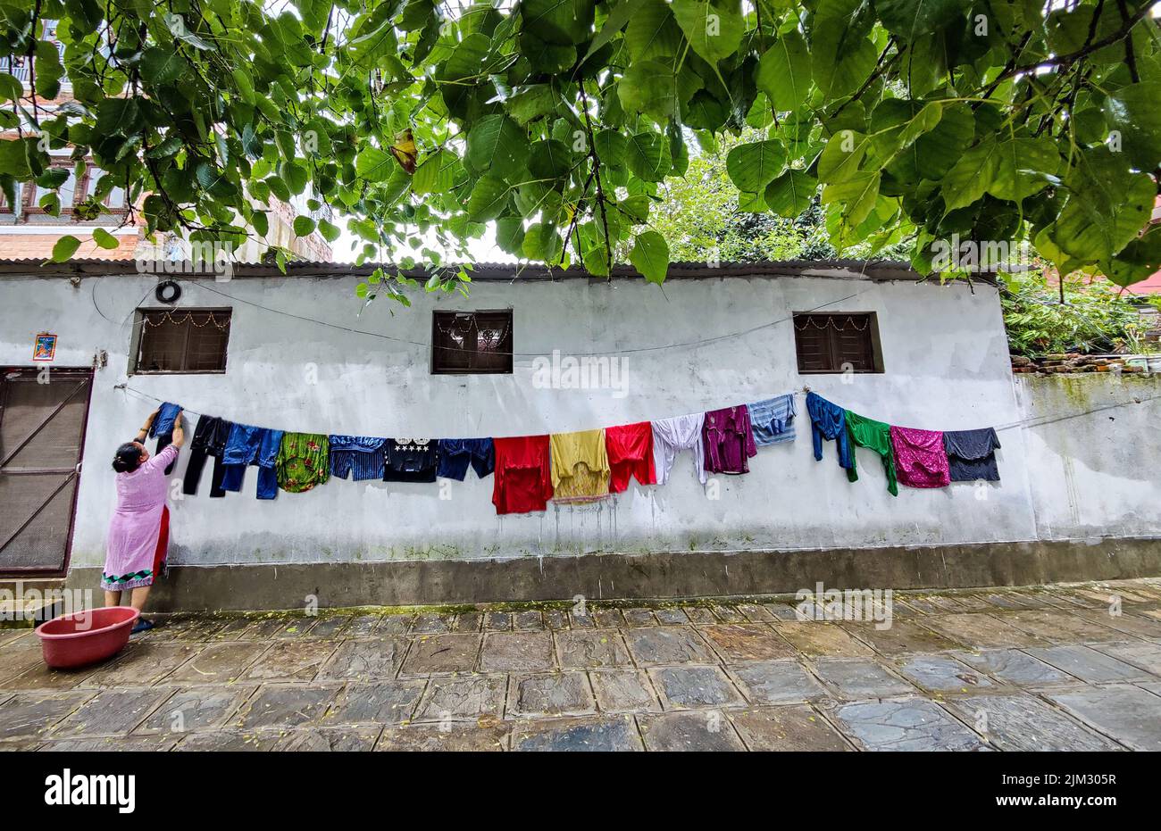 Nepal kathmandu woman washing clothes hi-res stock photography and ...