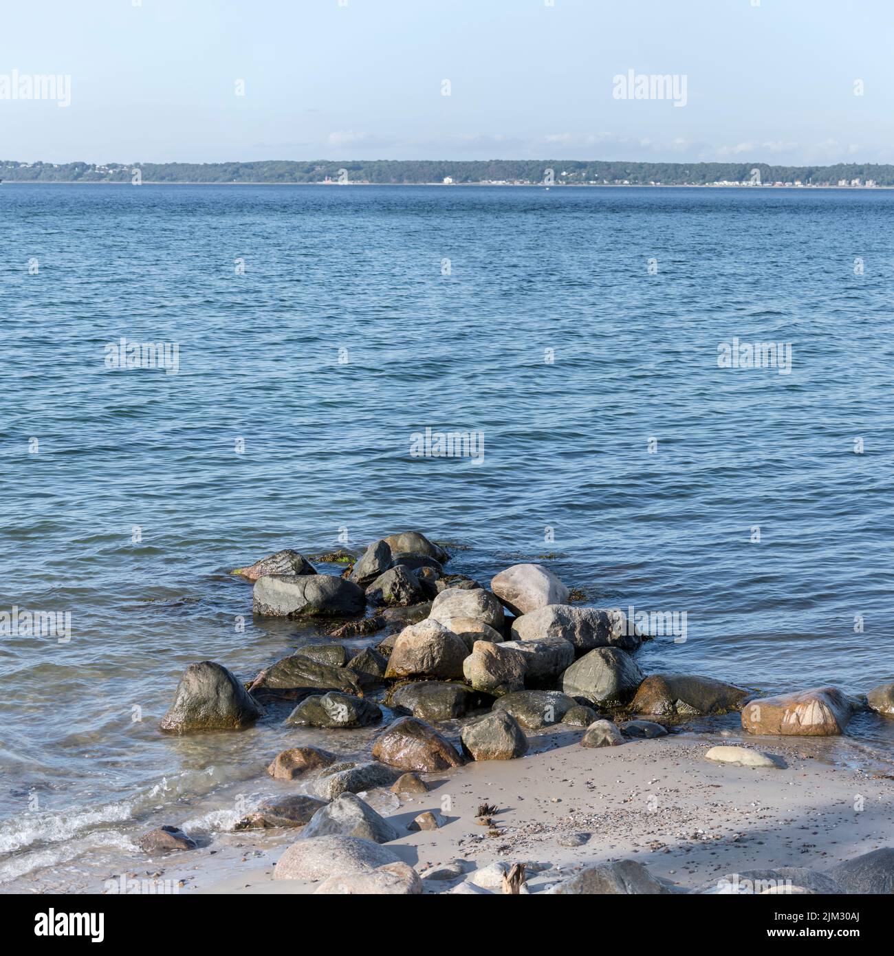 Stones in the sand on danish beach hi-res stock photography and images ...