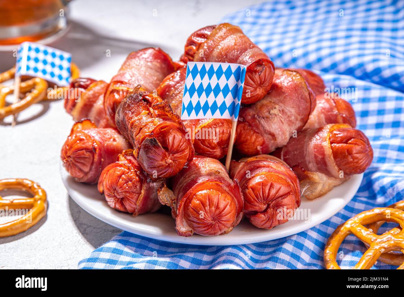 Oktoberfest party food. Pretzel hot dogs, puff pastry rolls with ...
