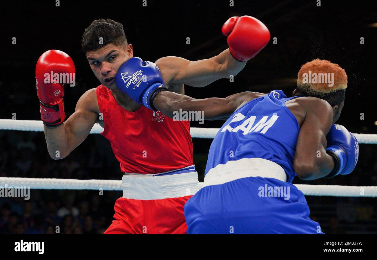 Australia's Alex Winwood (Red) and Zambia's Patrick Chinyemba (Blue) in ...