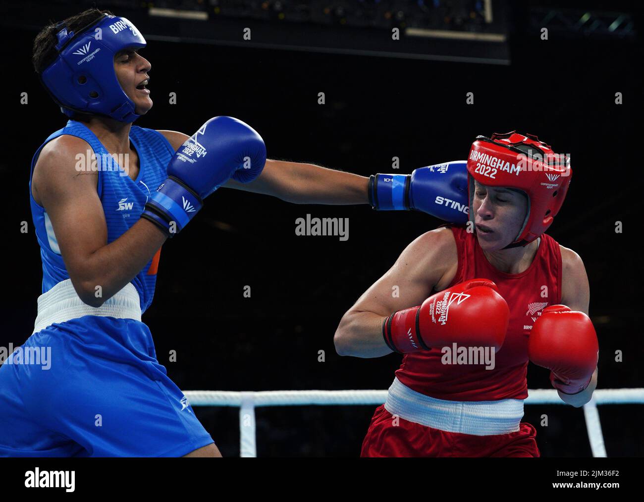 New Zealand's Troy Garton (Red) and India's Jaismine Jaismine (Blue) in ...