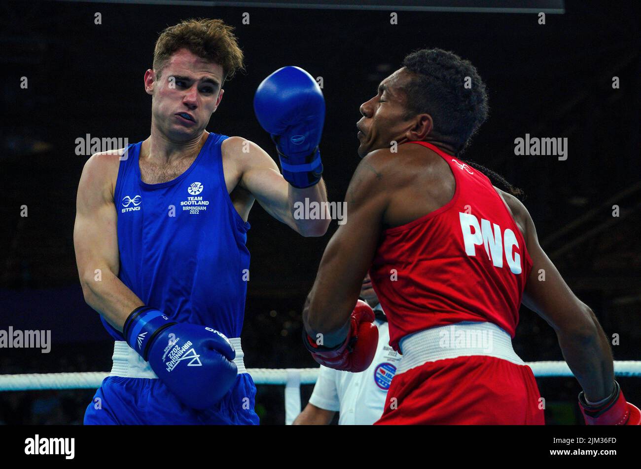 Papua New Guinea's Neville Warupi (Red) and Scotland's Tyler Jolly ...