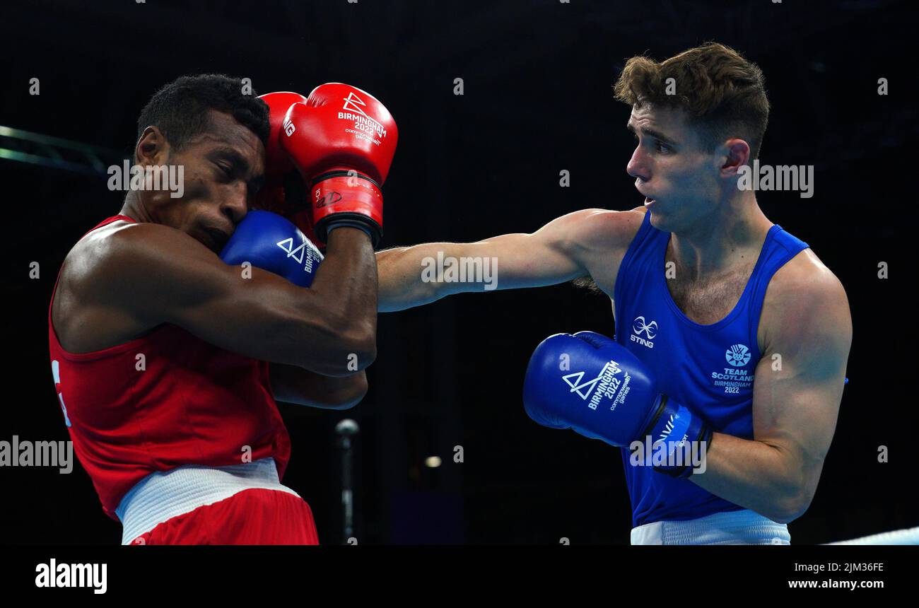 Papua New Guinea's Neville Warupi (Red) and Scotland's Tyler Jolly ...