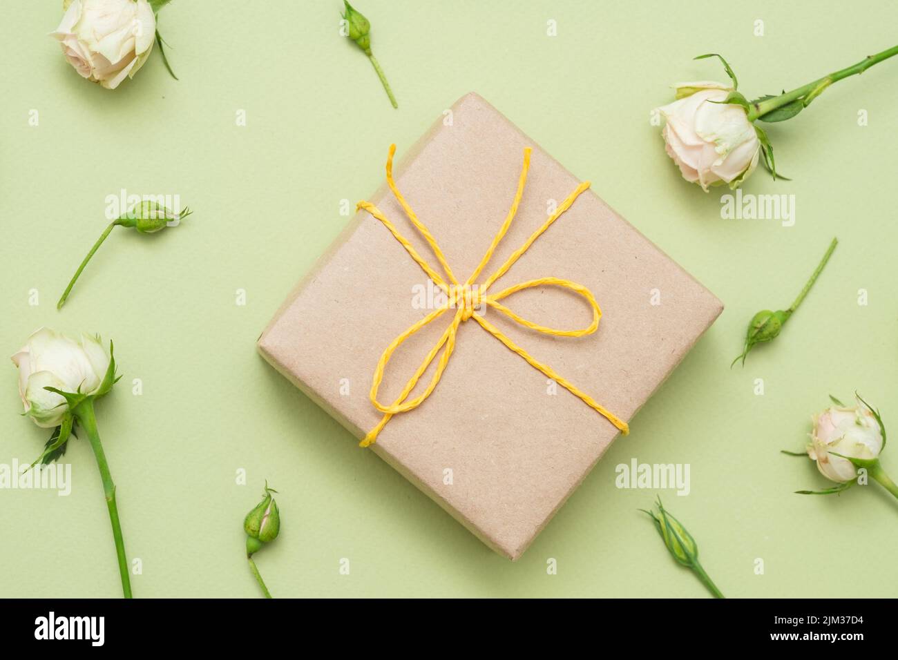 gift box scattered roses layout light background Stock Photo - Alamy