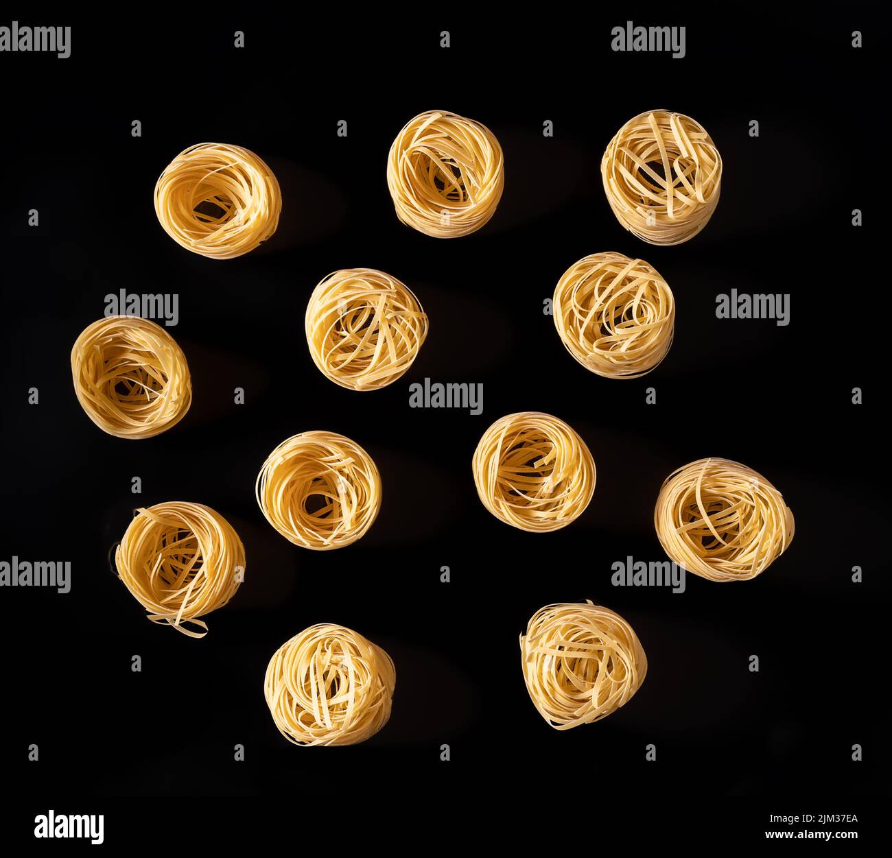 Flat lay Pasta, spaghetti on a black background top view Stock Photo ...