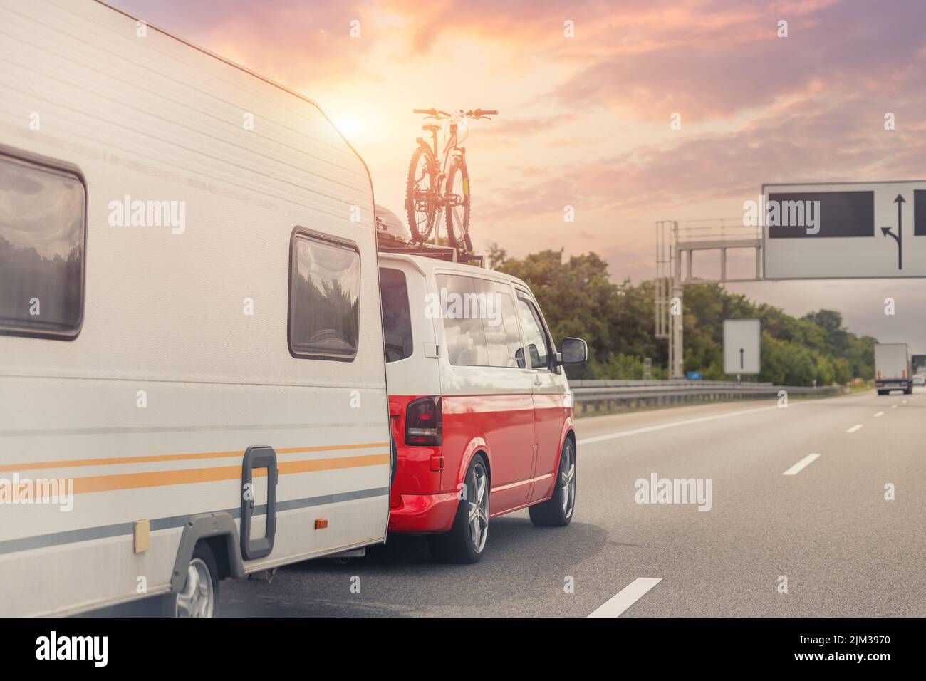 Scenic view big modern white family rv camper van vehicle driving on ...