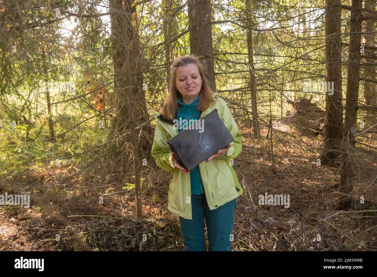 Geocaching in the woods Stock Photo - Alamy