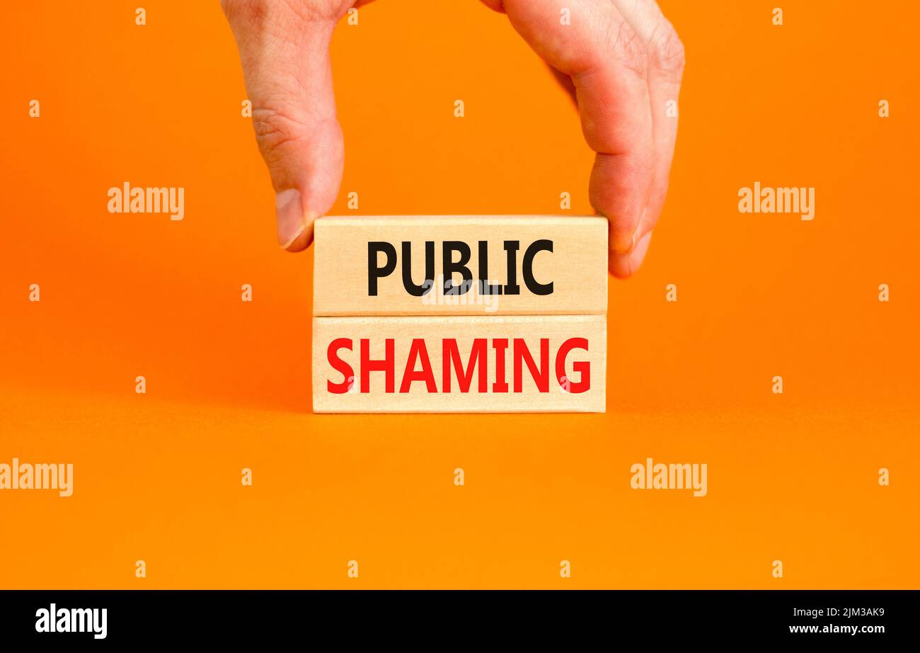 Public shaming symbol. Concept words Public shaming on wooden blocks on ...