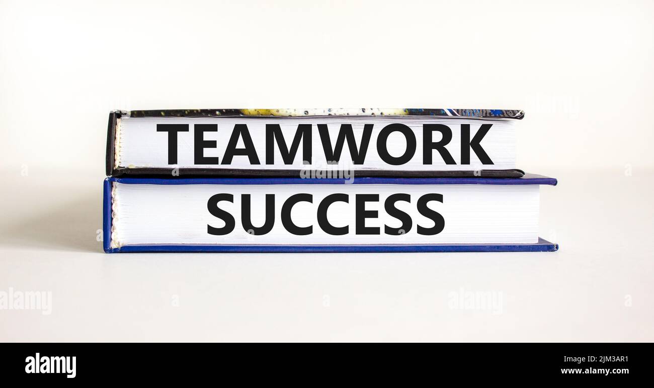 Teamwork success symbol. Concept words Teamwork success on books on a ...