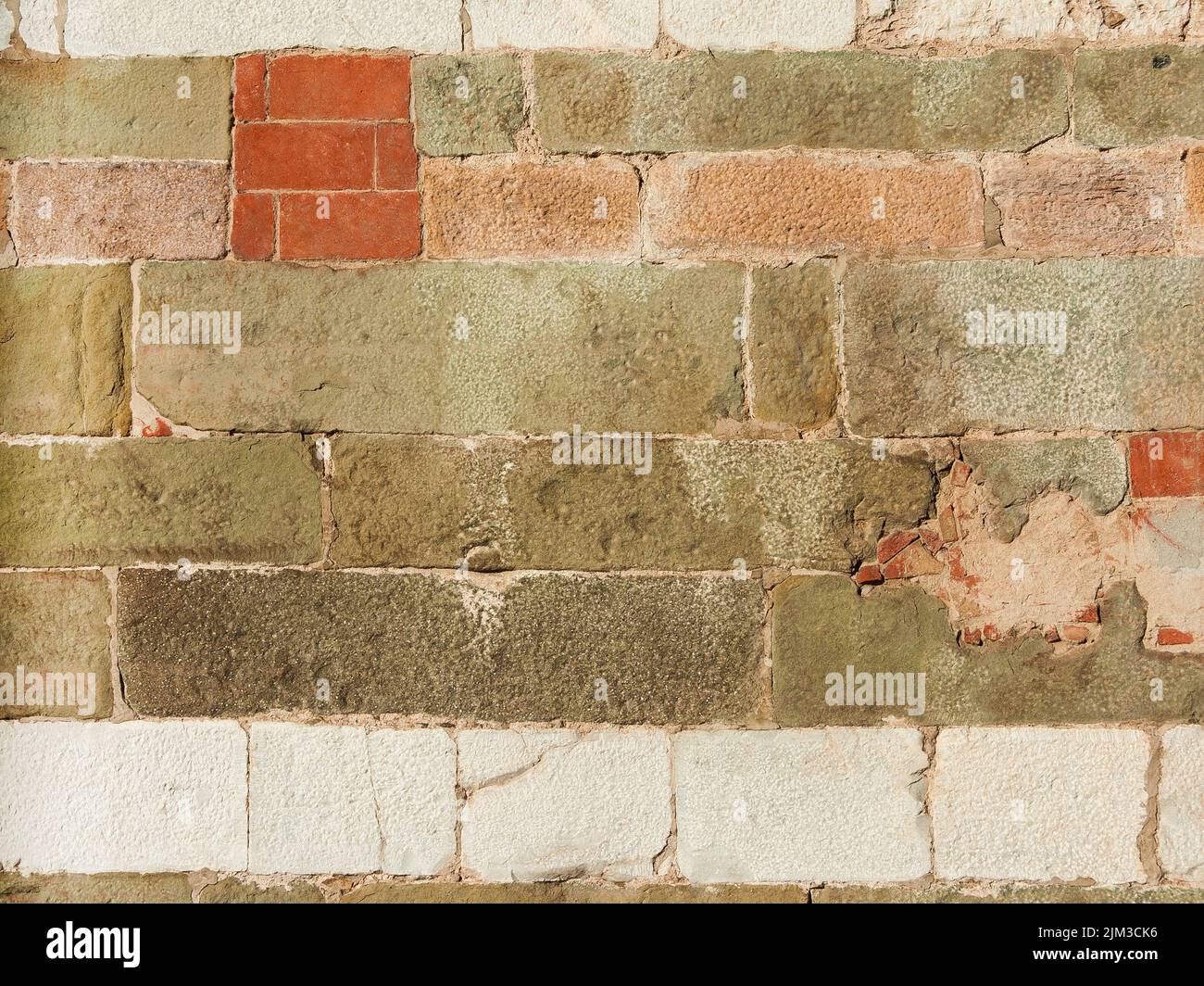 Ancient composite stone wall as background Stock Photo - Alamy