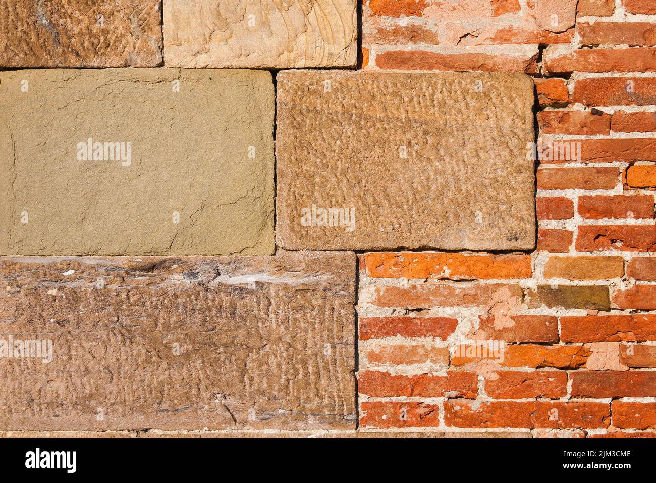 Ancient composite stone wall with red bricks as background Stock Photo ...