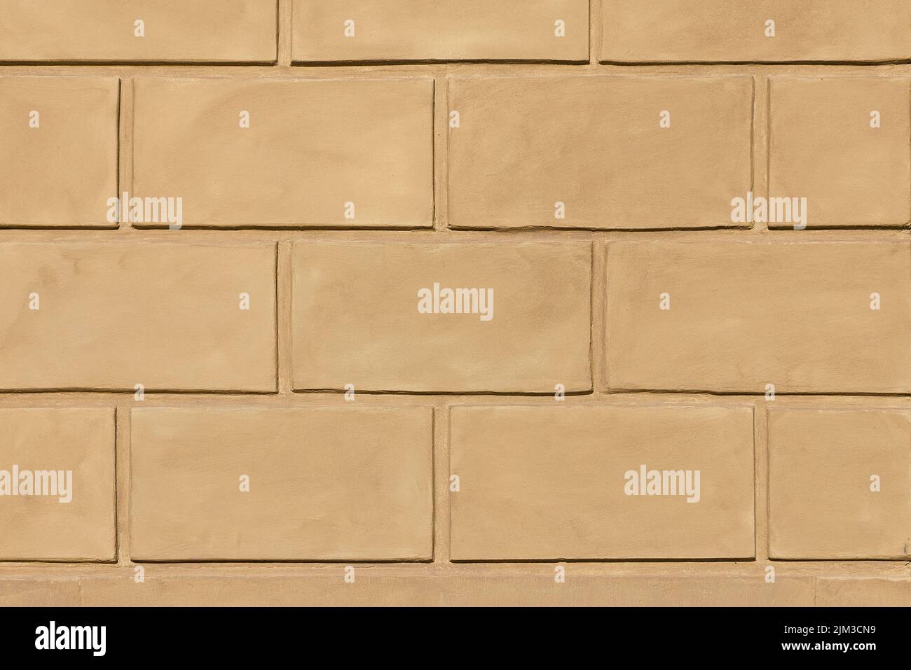 Brown plaster wall with rectangular concrete blocks Stock Photo - Alamy