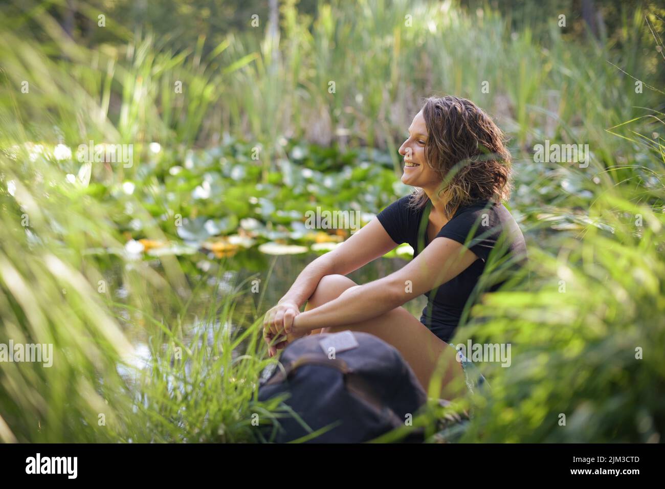 caucasian woman hiking in the french forest of Fontainebleau Stock ...