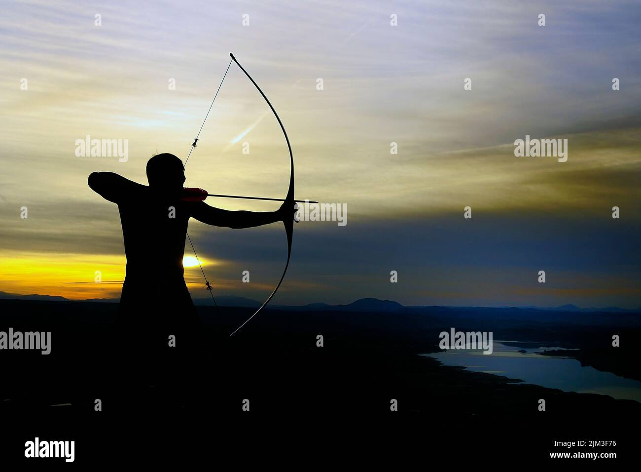 Silhouette of a man shooting an arrow hi-res stock photography and ...
