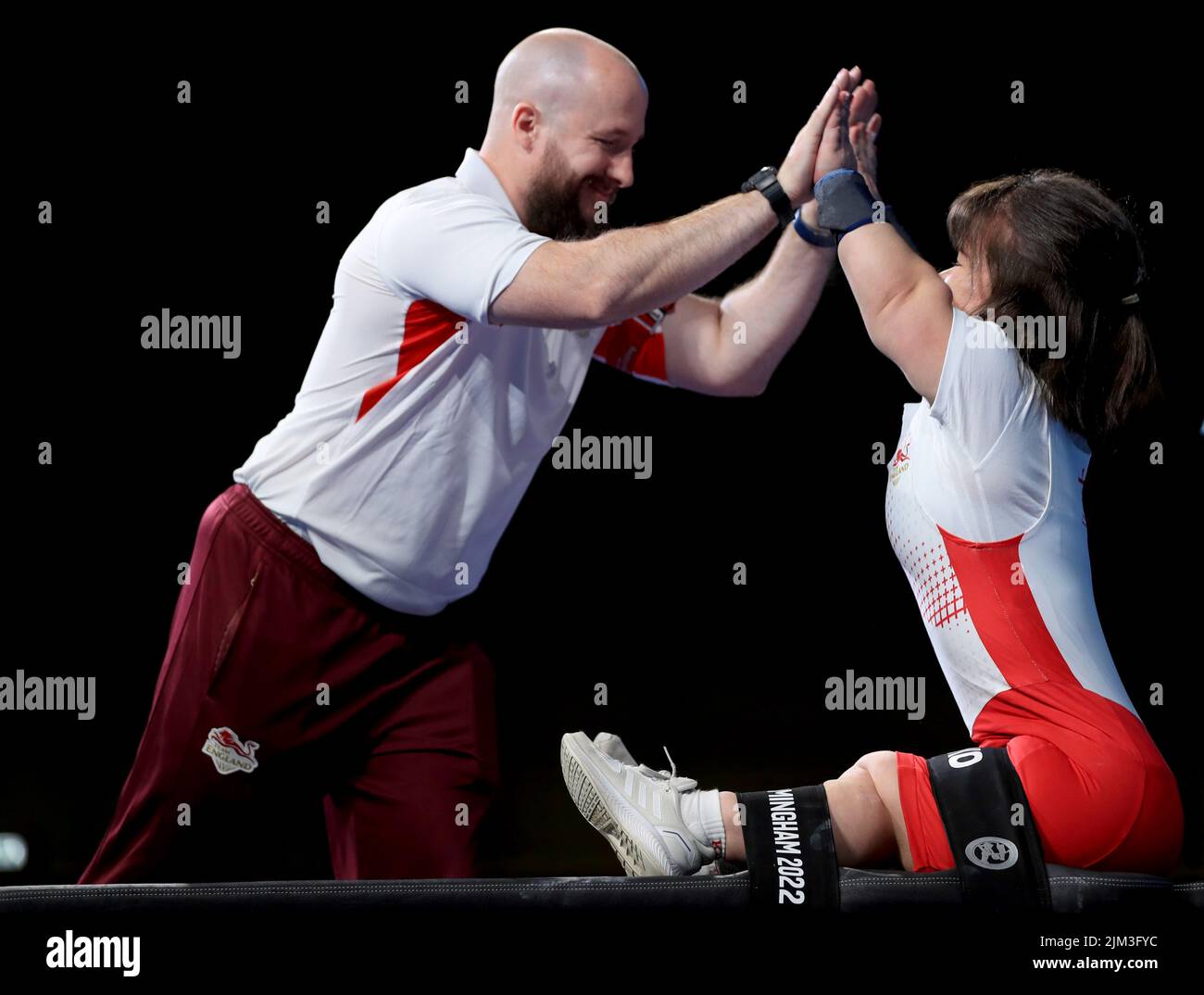 England’s Olivia Broome celebrates with her trainer after completing a ...