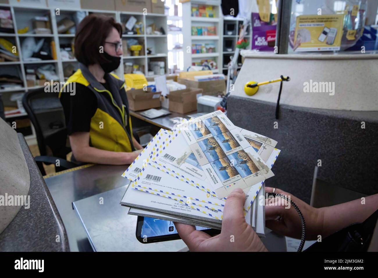Kyiv, Ukraine. 24th May, 2022. A woman shows a new series of stamps ...