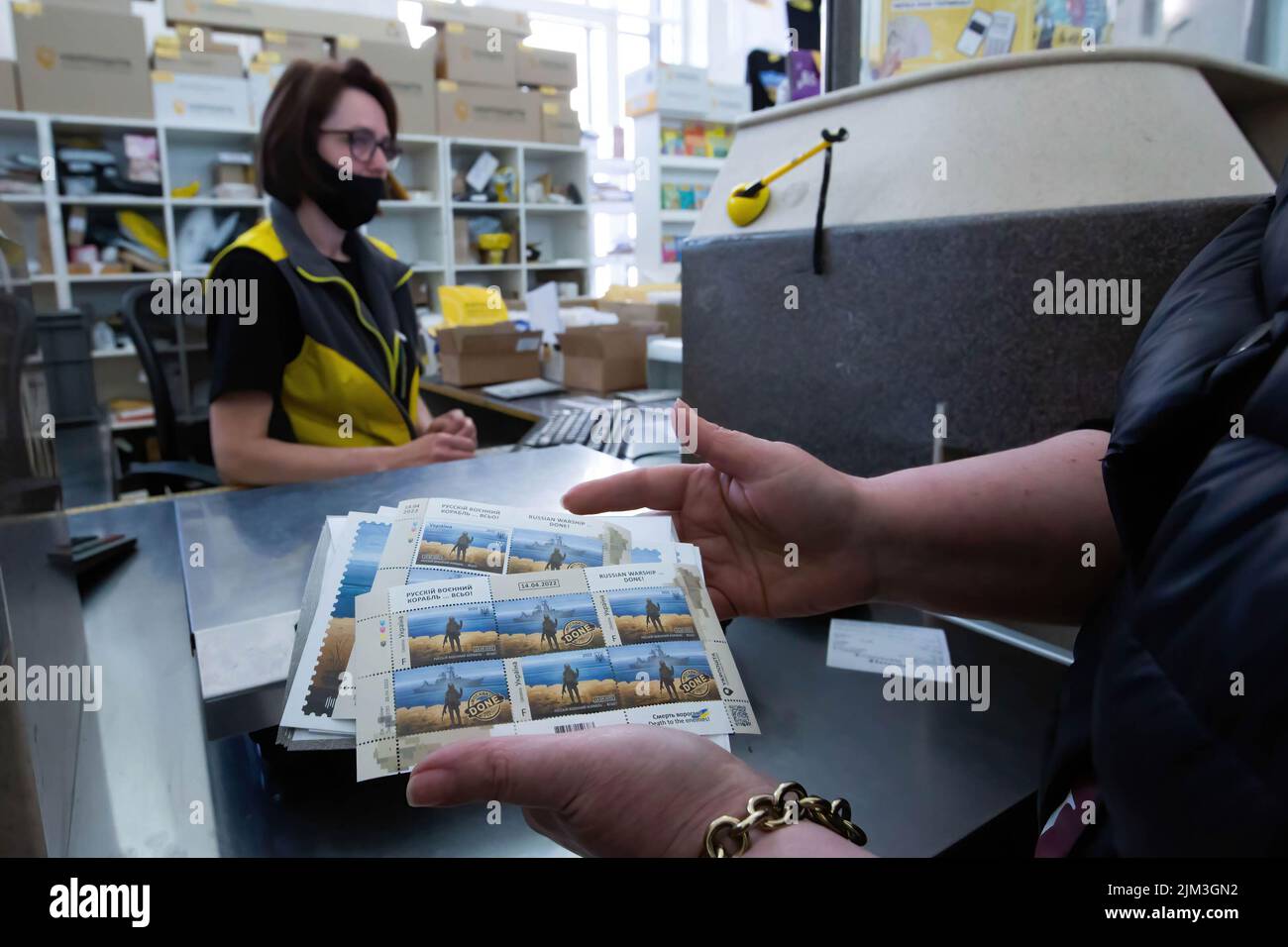 Kyiv, Ukraine. 24th May, 2022. A woman shows a new series of stamps ...