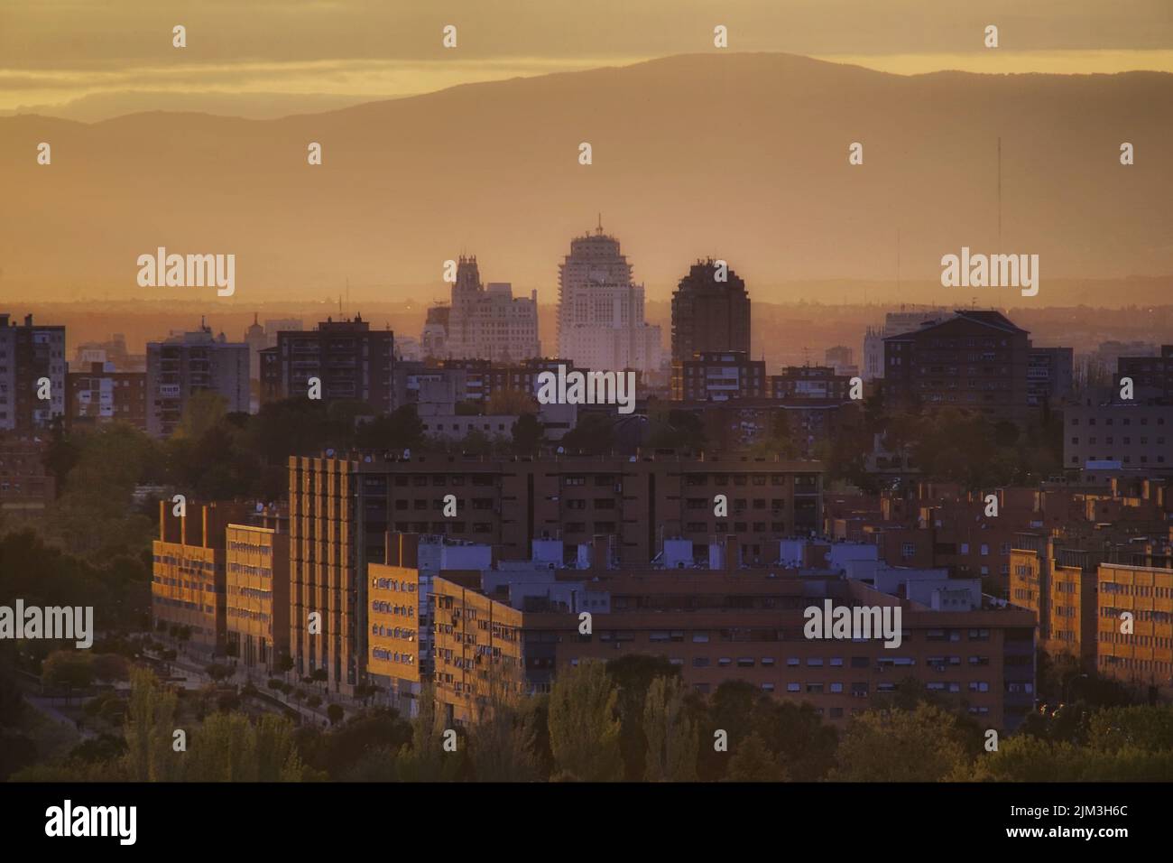 A cityscape scenery of Madrid with modern buildings at sunset Stock ...