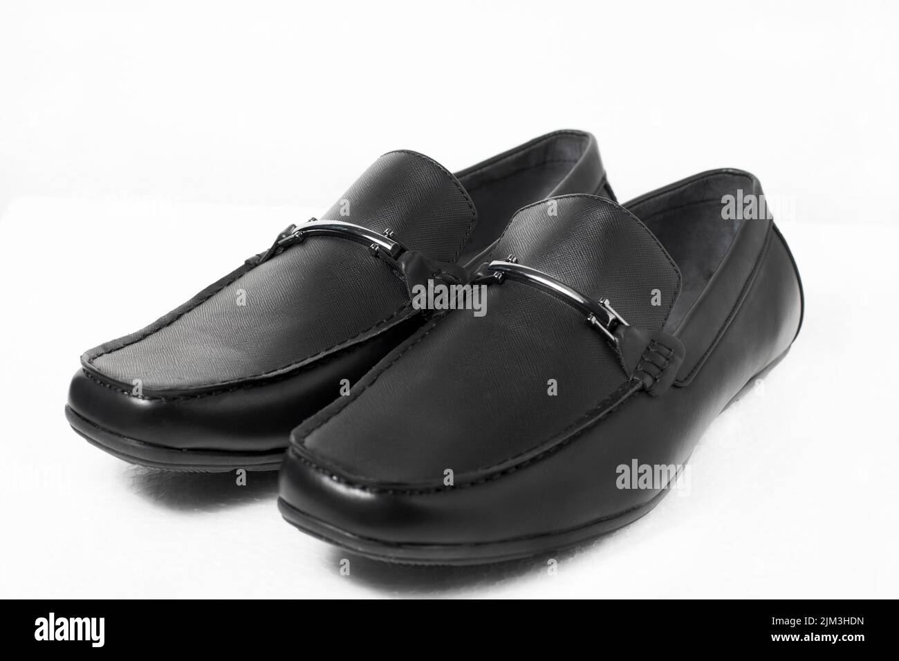 A closeup shot of black leather shoes for men on white background Stock ...