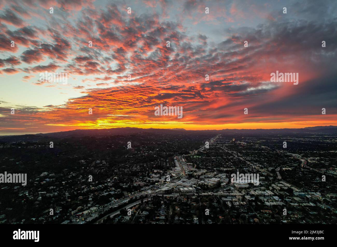 A bright orange pink sunset sky over the Los Angeles skyline Stock ...