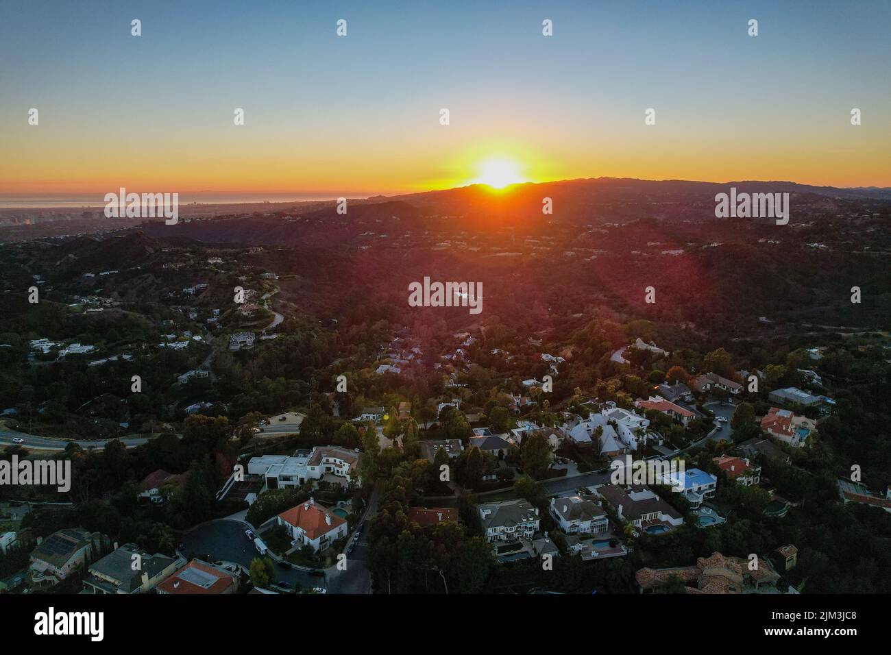 An aerial view of a bright sunset sky over the Hollywood area in ...