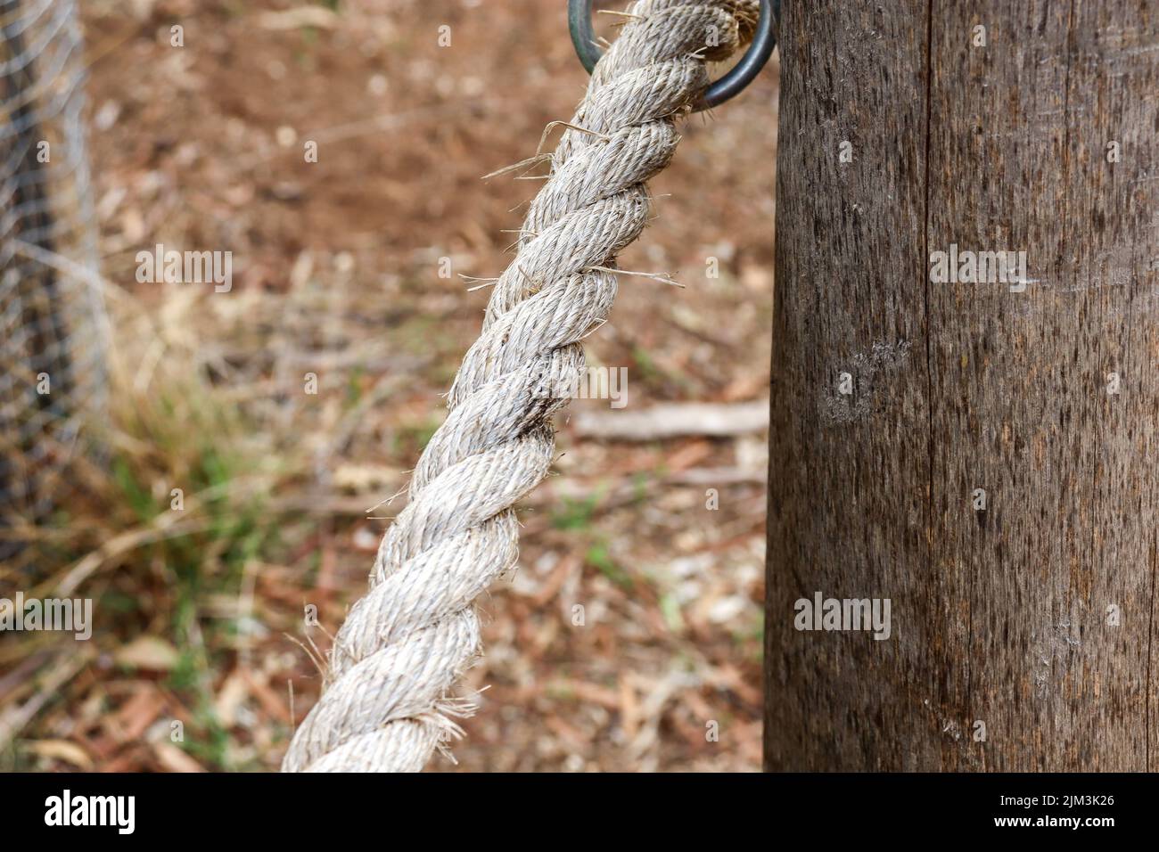 old wooden post and rope fence in parkland Stock Photo - Alamy