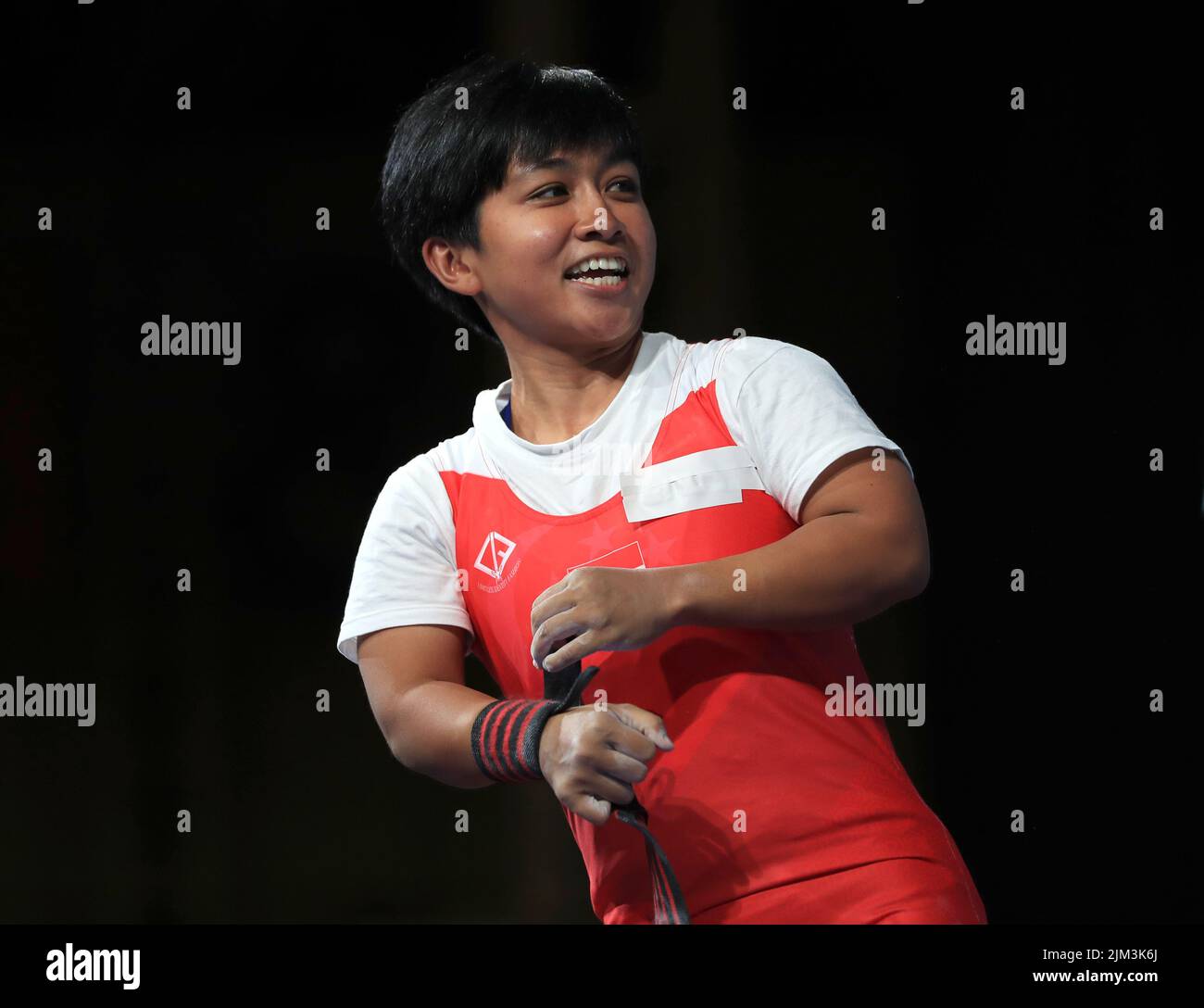 Singapore’s Nur Aini Yasli celebrates after completing a lift in the ...