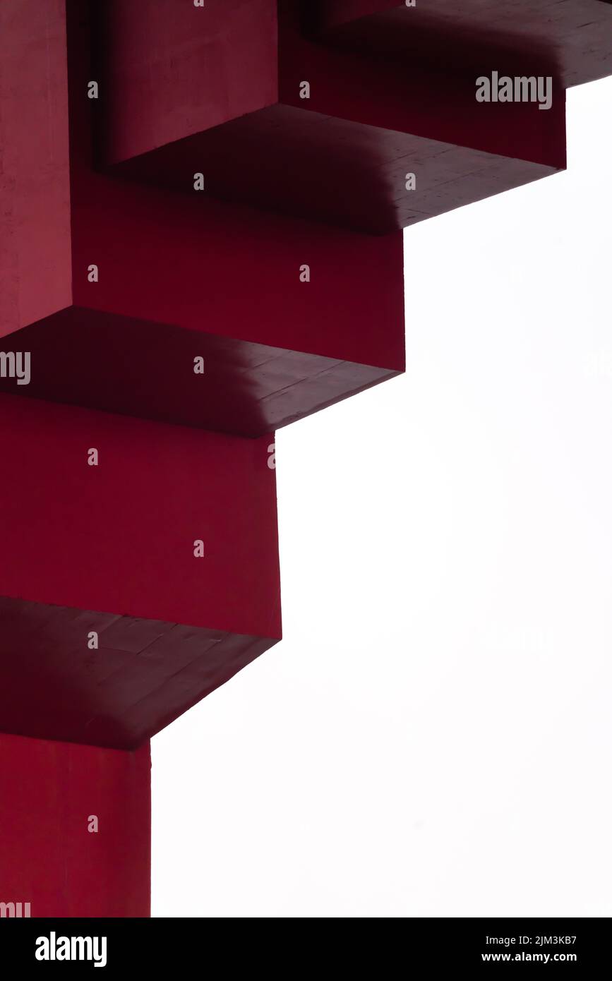 A vertical closeup shot of red modern architecture exterior with a ...