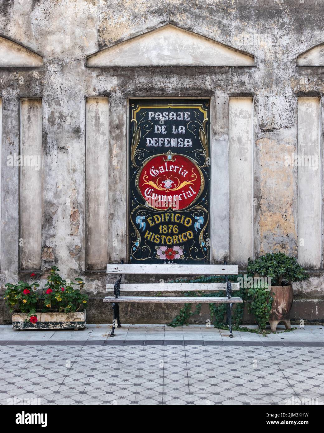 A vertical shot of a wooden bench near a market in Buenos Aires ...